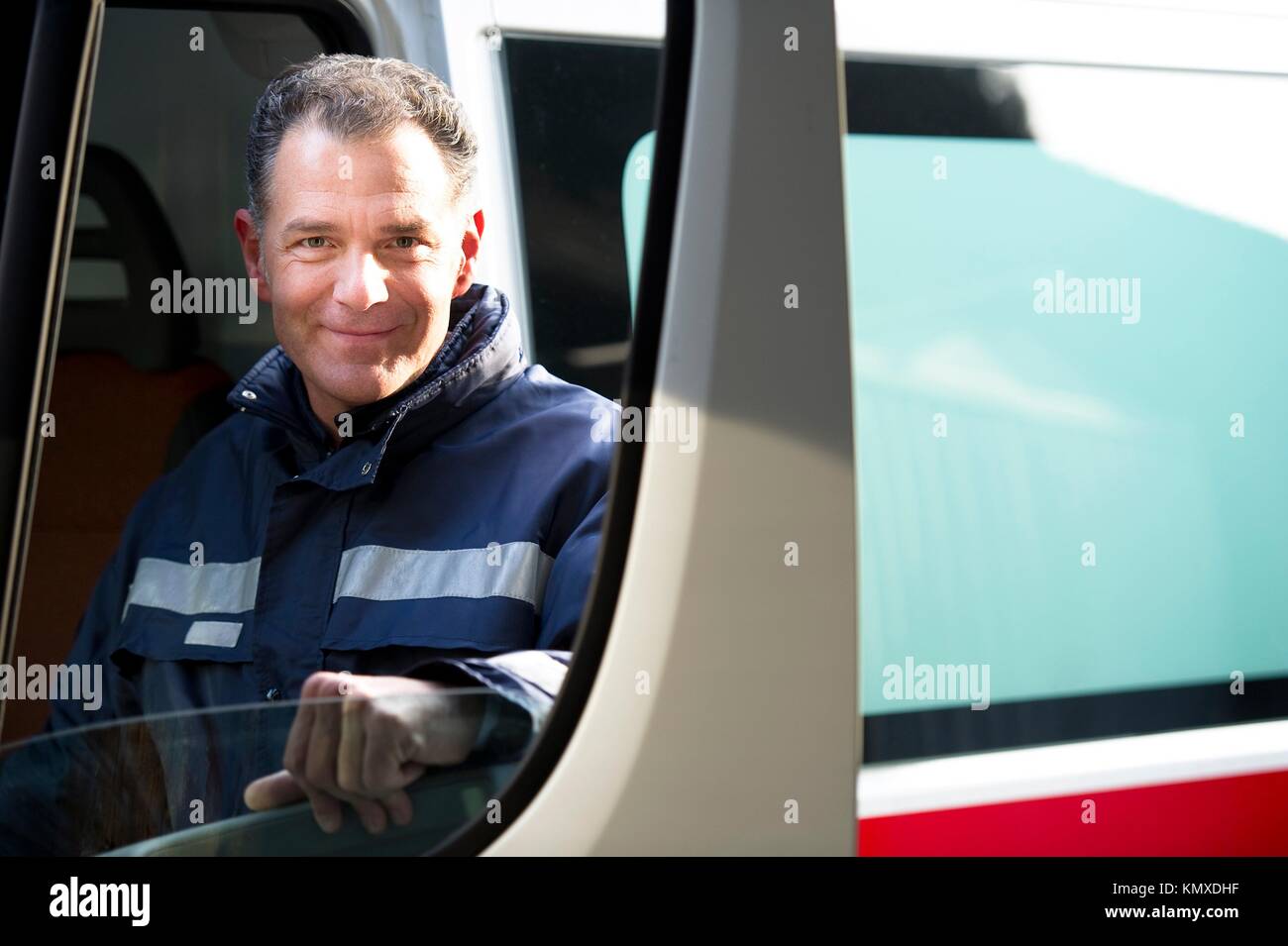 Male paramedic driving ambulance Stock Photo - Alamy