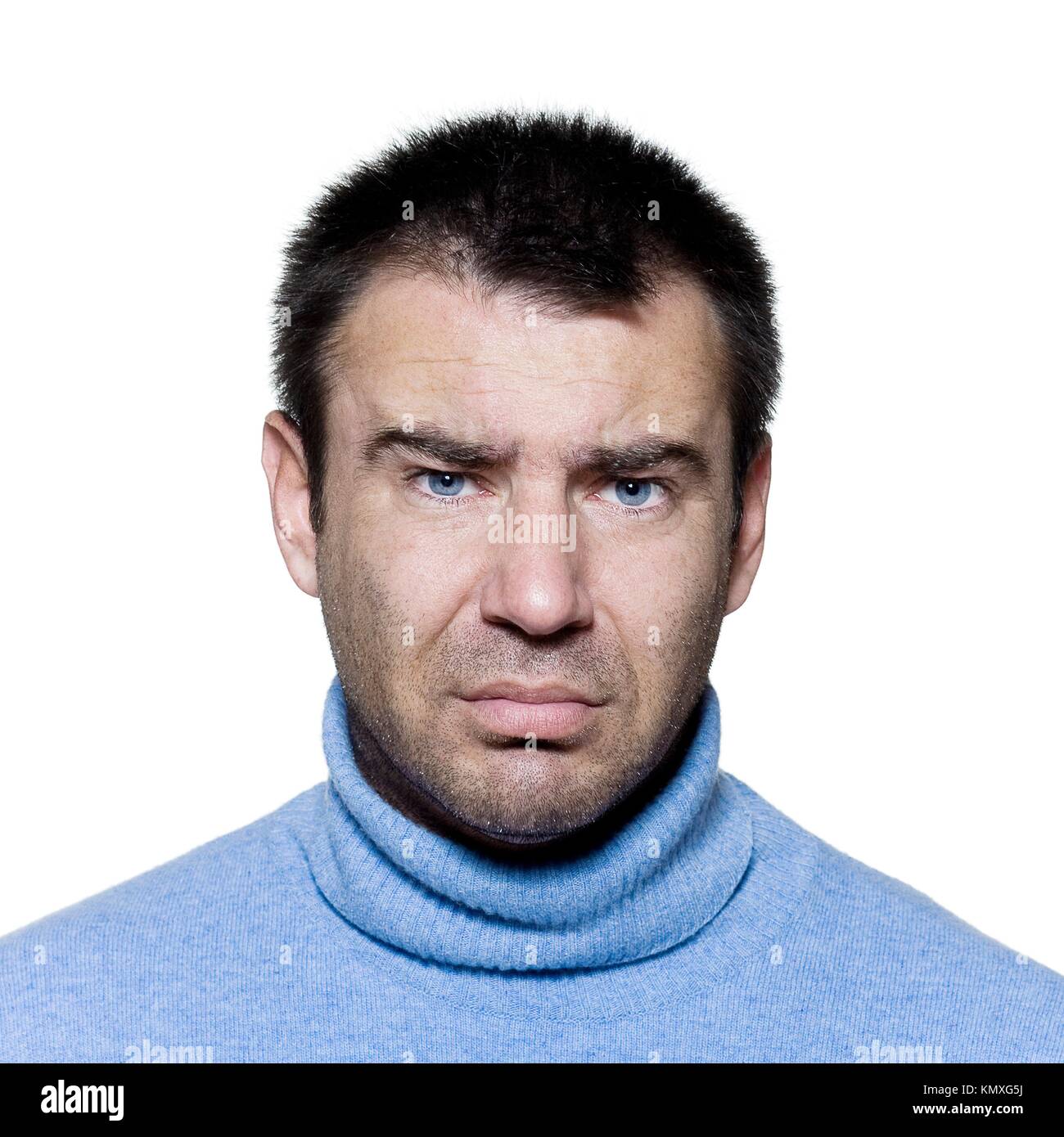 studio portrait on isolated background of a stubble man sad pucker ...