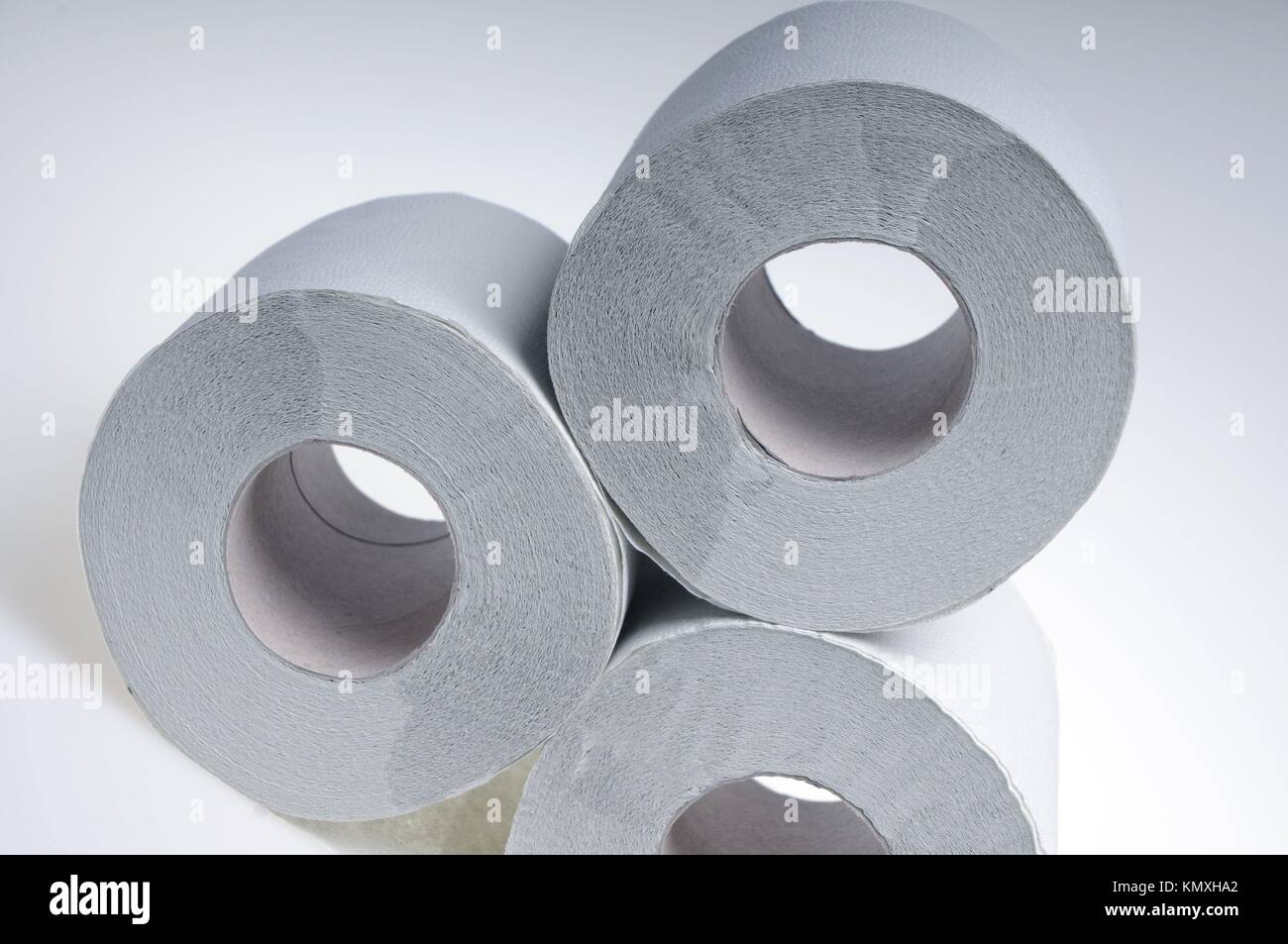 Three rolls of simple grey toilet paper made of waste paper Stock Photo ...