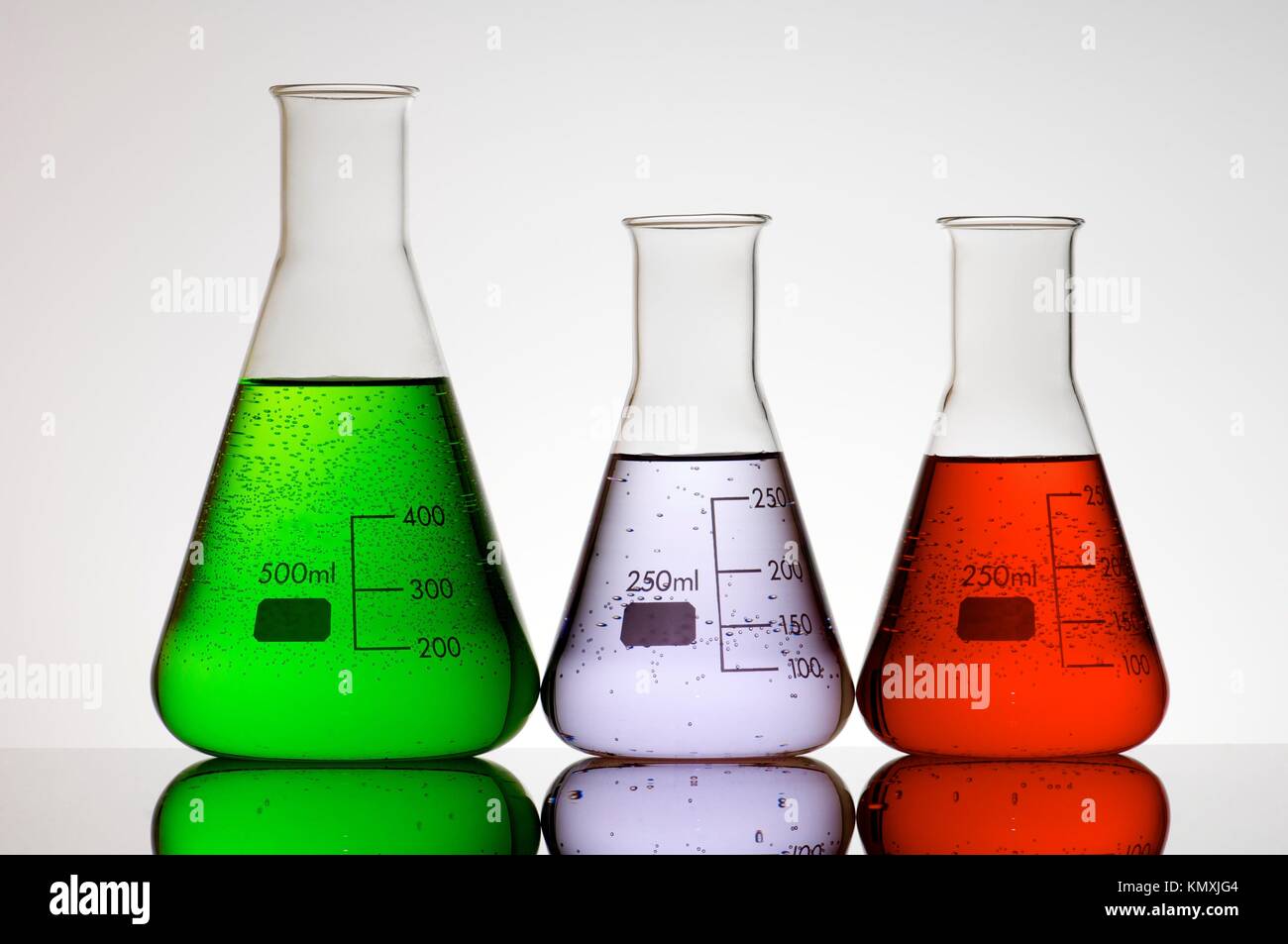 group of laboratory flasks containing liquid color Stock Photo - Alamy