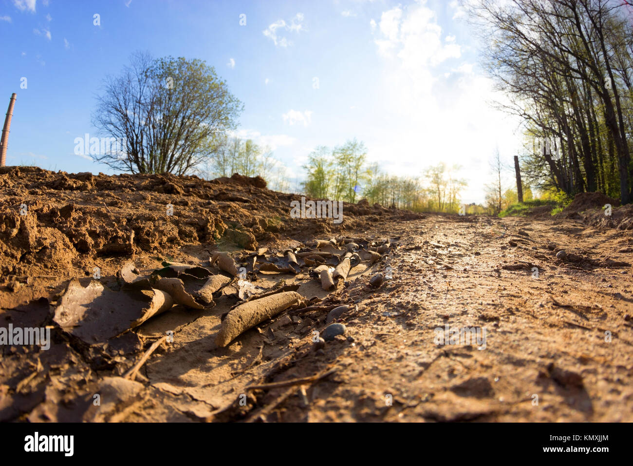 rural dirty road on a green field Stock Photo - Alamy