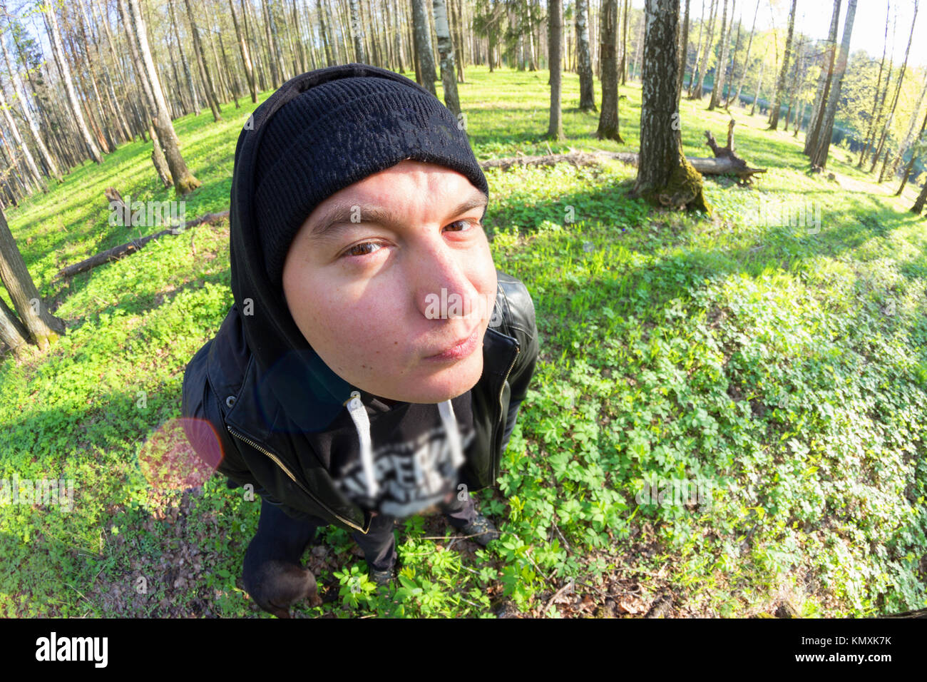 funny young men looking curious. fisheye lens Stock Photo - Alamy