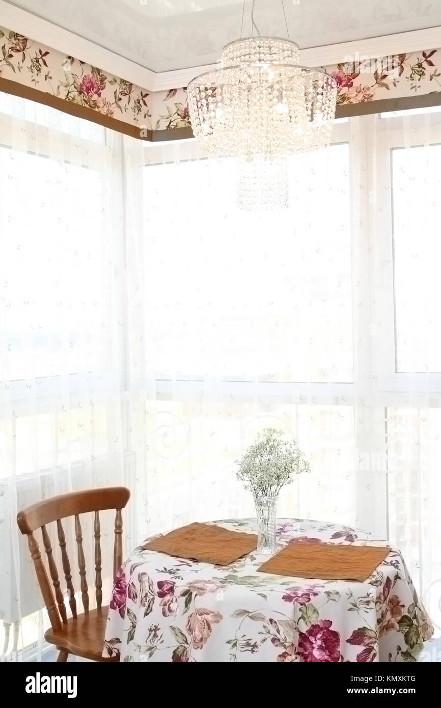interior of modern kitchen, view of a window and little table with ...