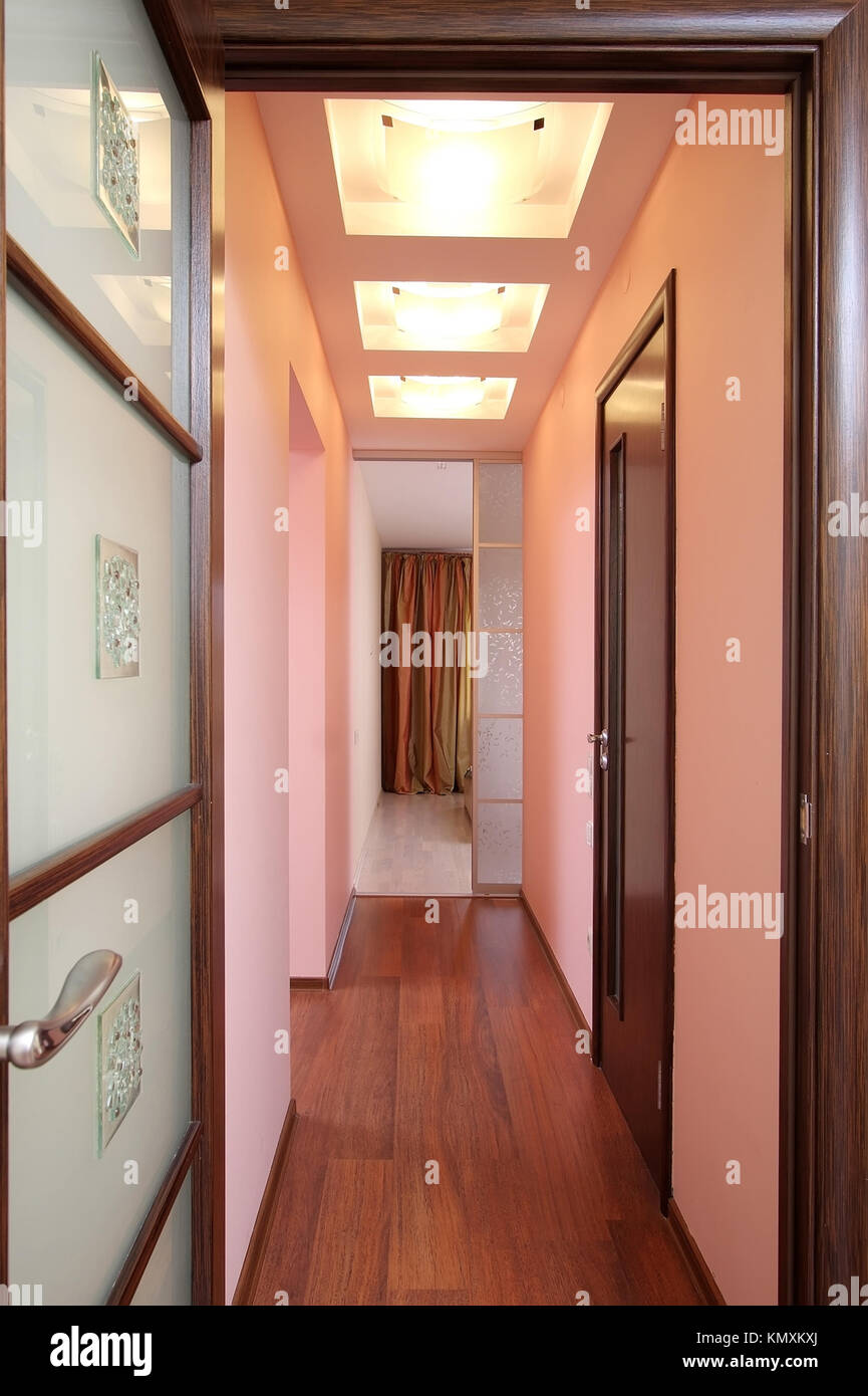 Long corridor with set of doors Stock Photo - Alamy