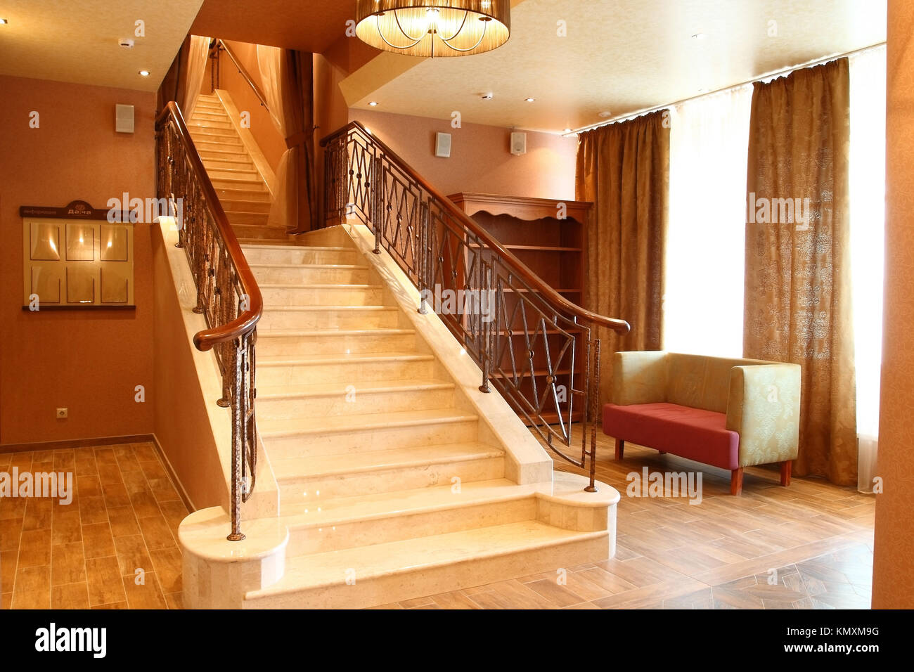 Spacious hall of hotel overlooking a wide ladder Stock Photo - Alamy