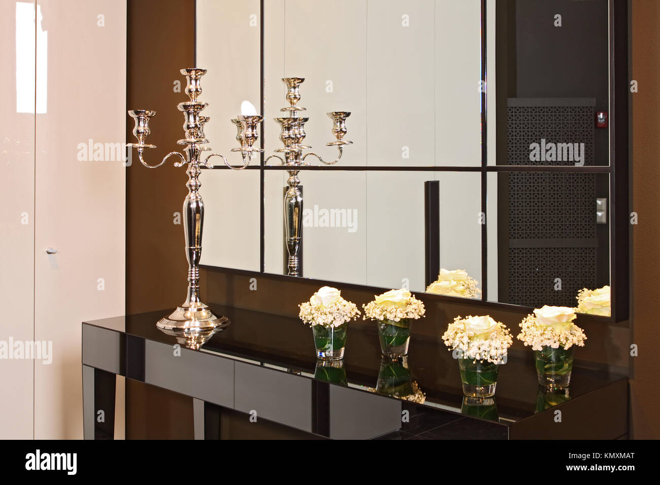Spacious modern lobby with the big mirror and a bench from a skin Stock ...