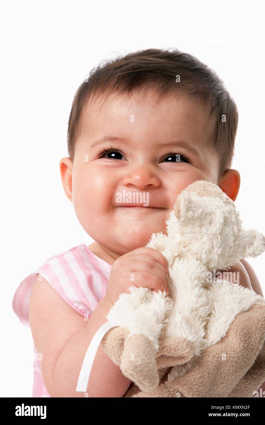 Beautiful happy cute baby girl smiling face with security blanket toy ...