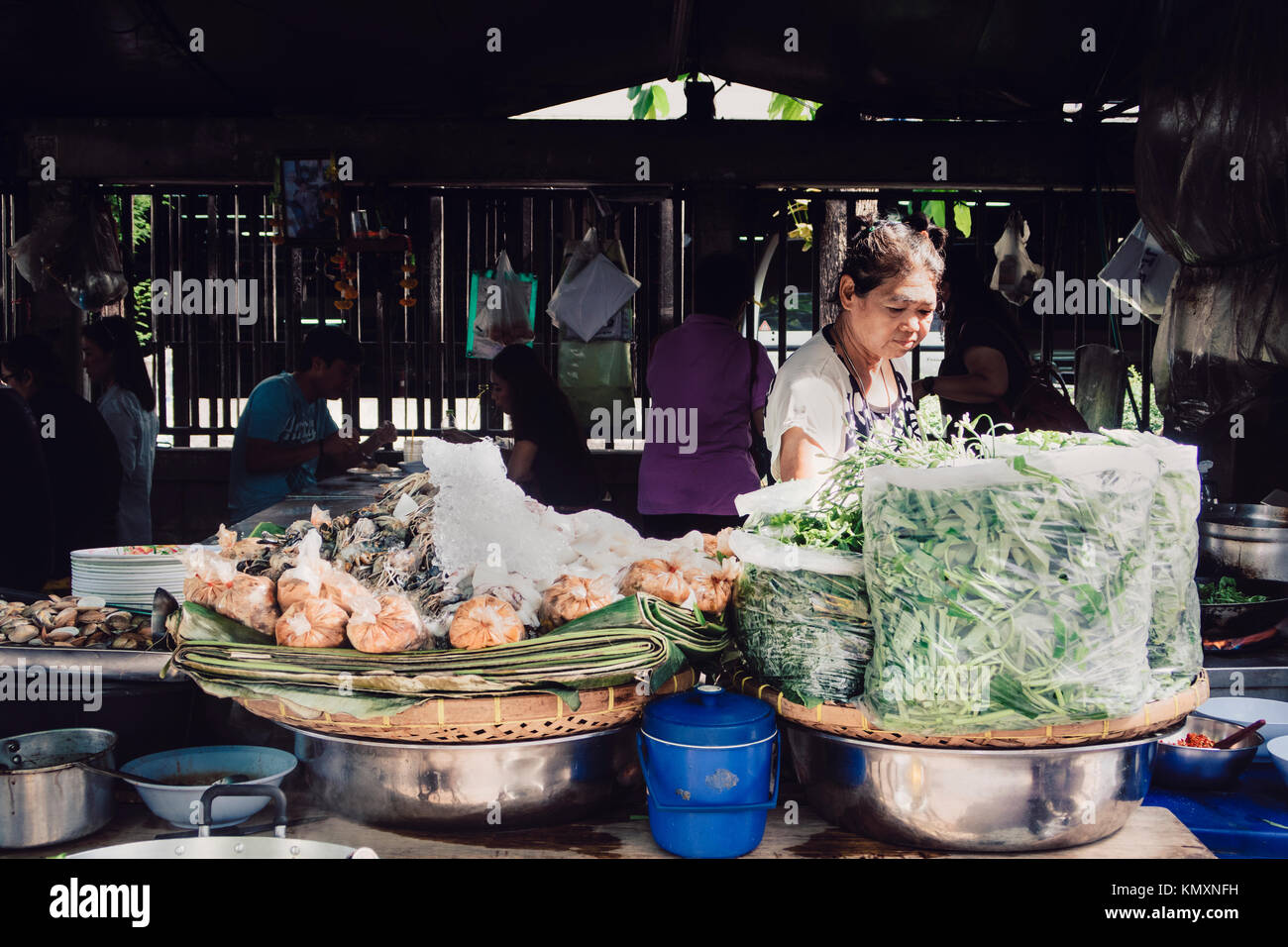 An old lady cooking Tom Yang Kung in the morning at Banglamphu Market ...