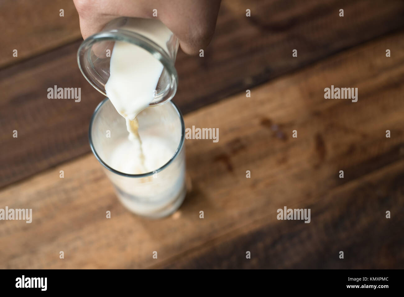 close up - pouring milk into glass. filling a glass with milk Stock ...