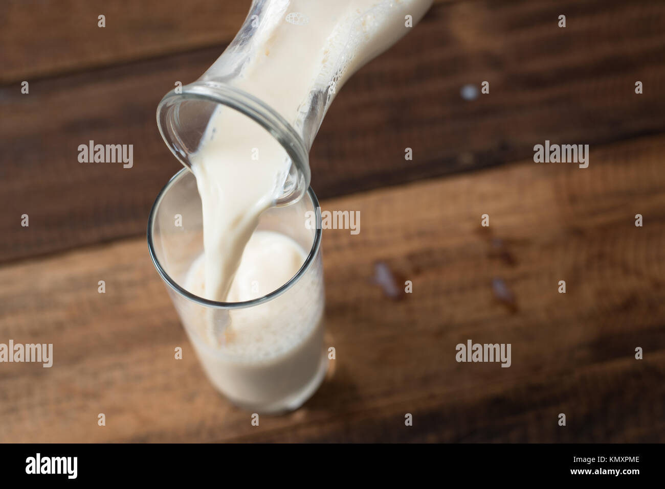 close up - pouring milk into glass. filling a glass with milk Stock ...
