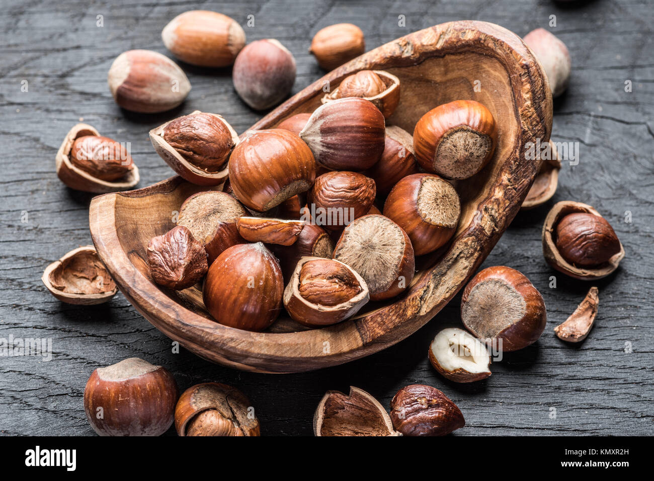 Filberts or hazelnuts in the wooden bowl on the table Stock Photo - Alamy