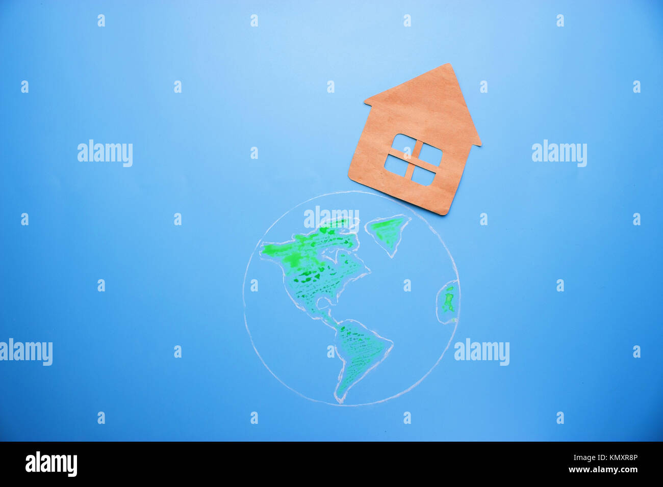 paper house on the green earth. eco house concept Stock Photo - Alamy