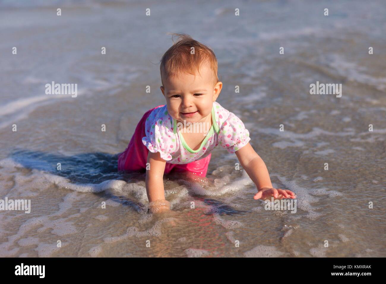 Baby playing in water hi-res stock photography and images - Alamy