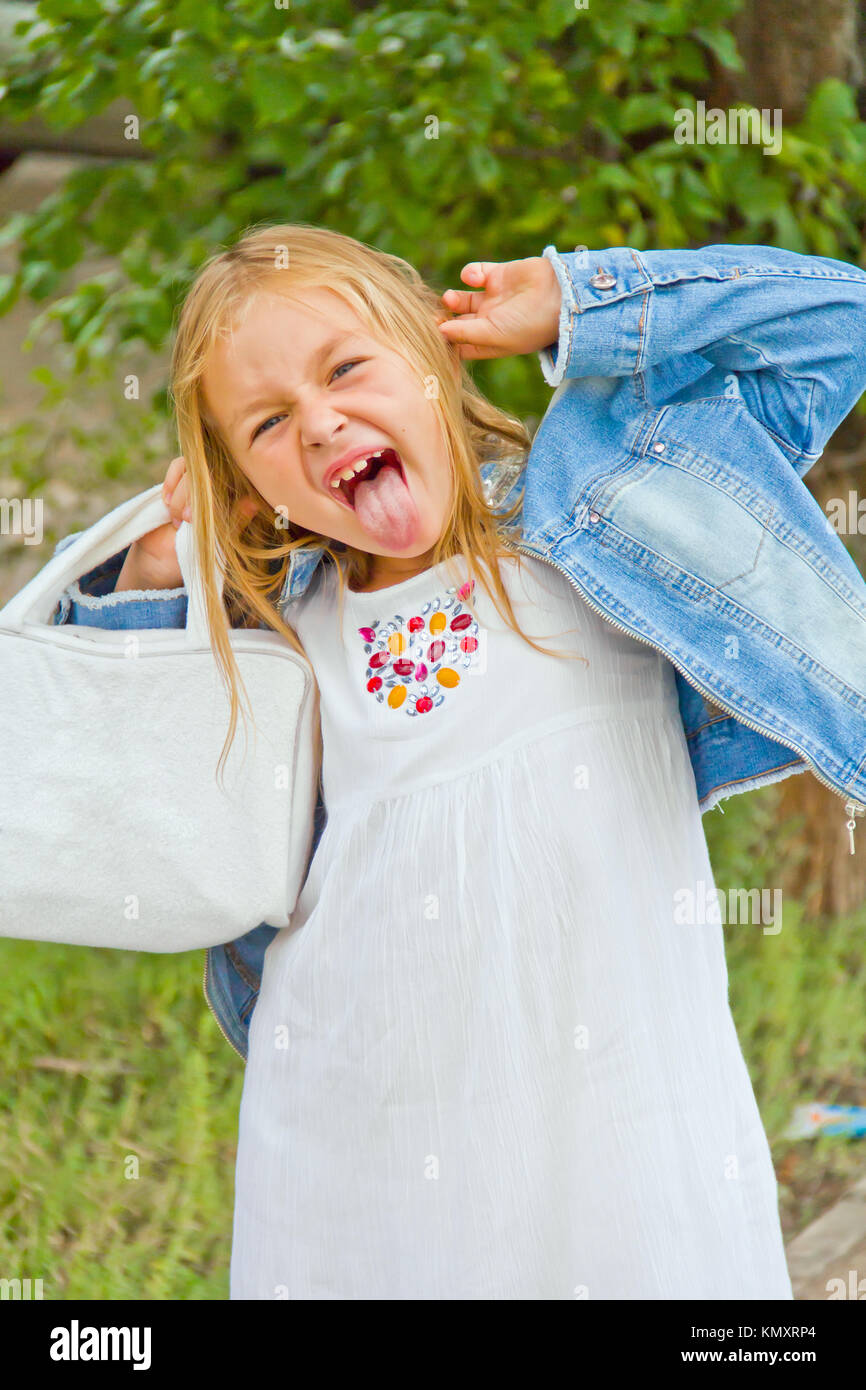Cute beautiful girl makes faces imitate witch Stock Photo - Alamy