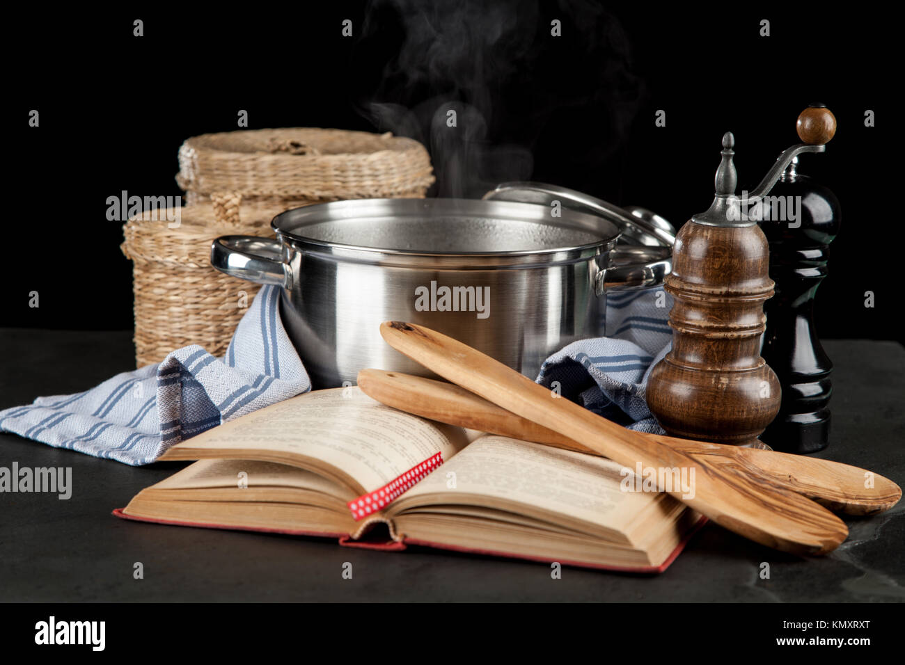 Steaming pot on black background Stock Photo - Alamy