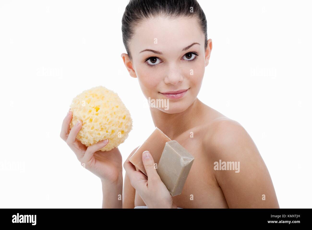 Beautiful young woman with aroma soap and sponge Stock Photo - Alamy