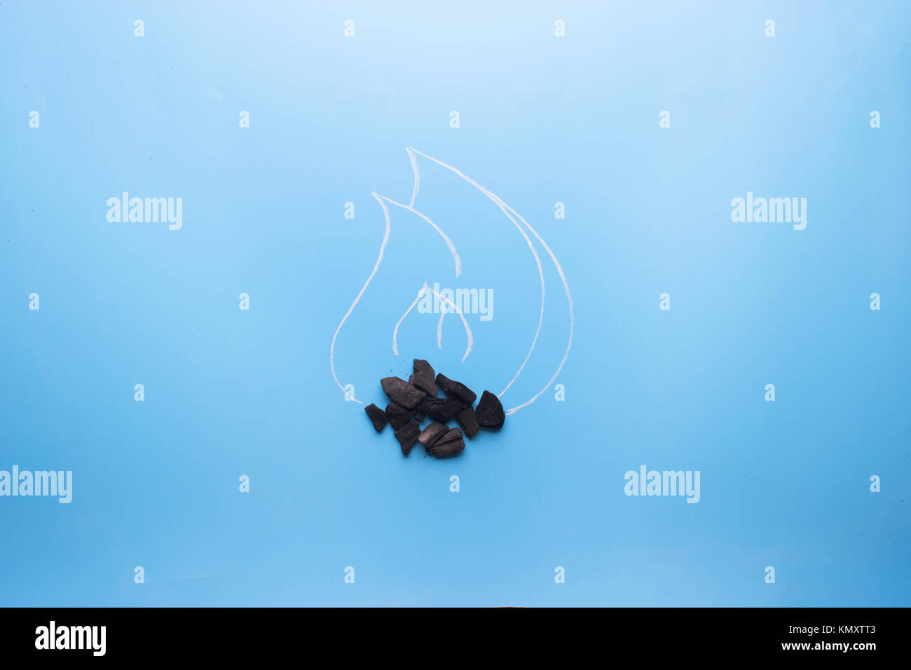 Bonfire painted 0n blue background with copy space Stock Photo - Alamy