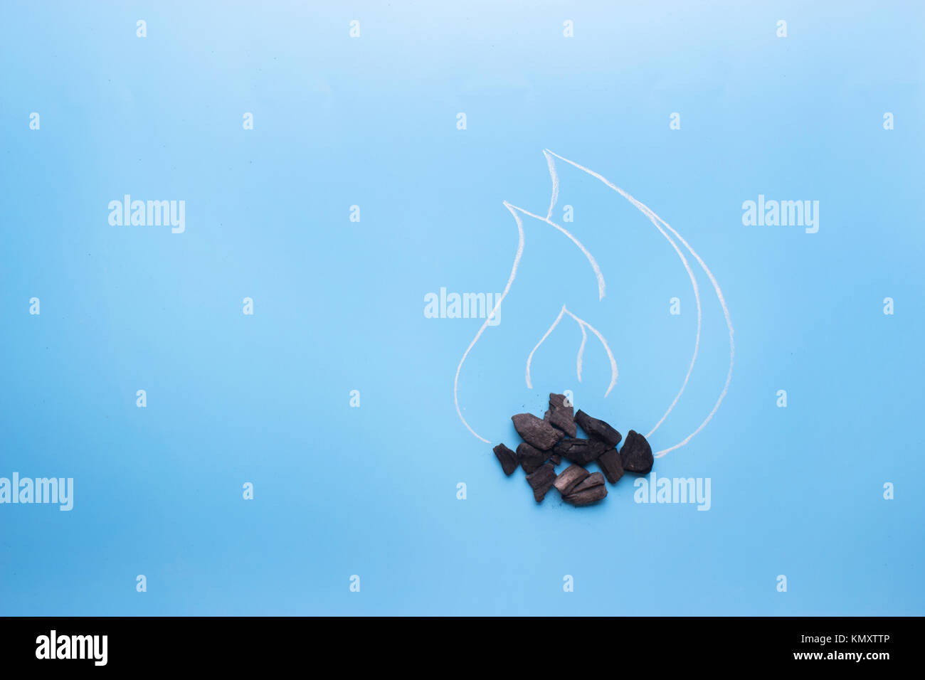 Bonfire painted 0n blue background with copy space Stock Photo - Alamy