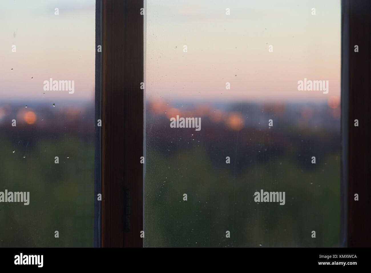 blurred image of a city through window. sunrise Stock Photo - Alamy