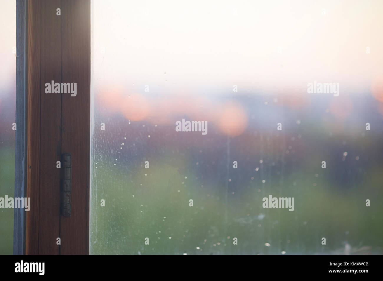 blurred image of a city through window. sunrise Stock Photo - Alamy