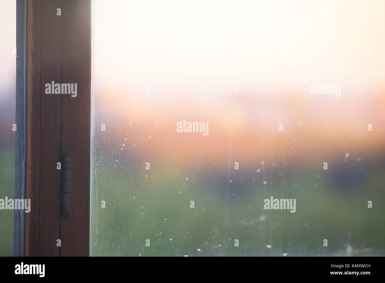 blurred image of a city through window. sunrise Stock Photo - Alamy