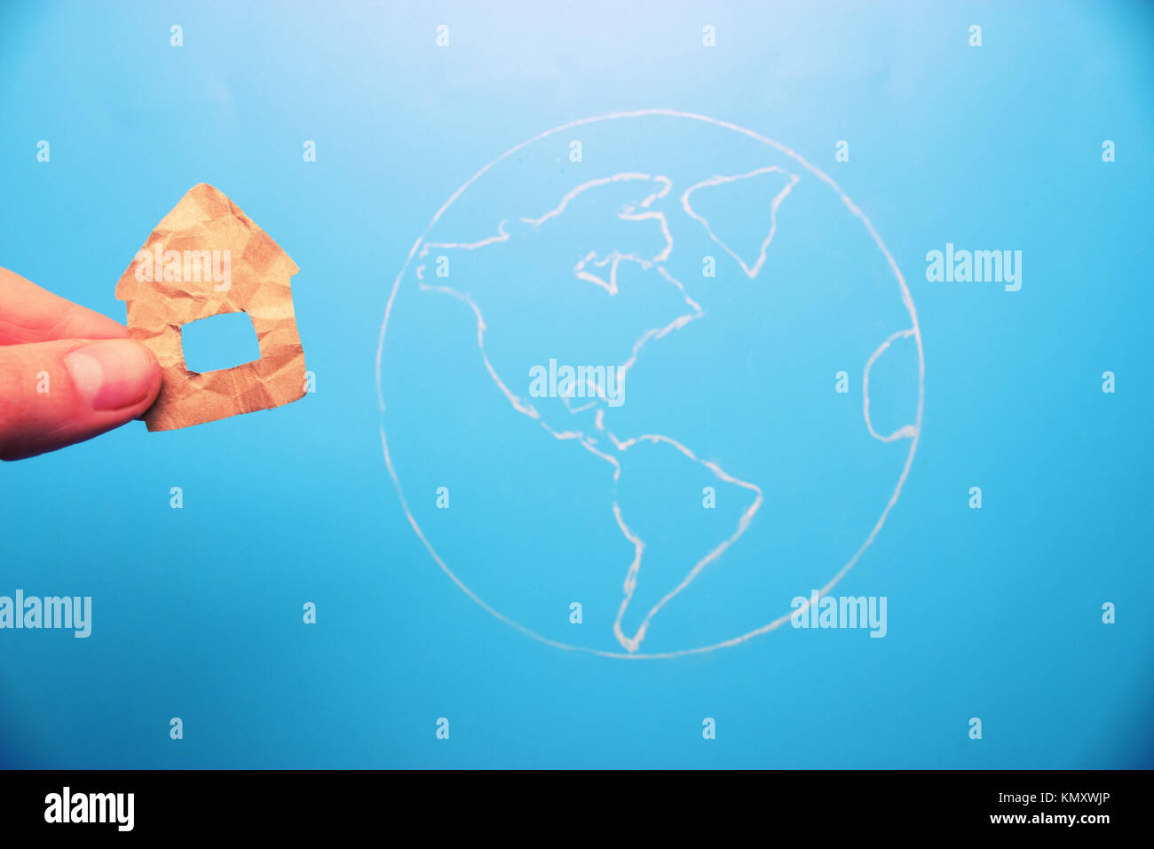 choose a place to live. paper house and a map Stock Photo - Alamy