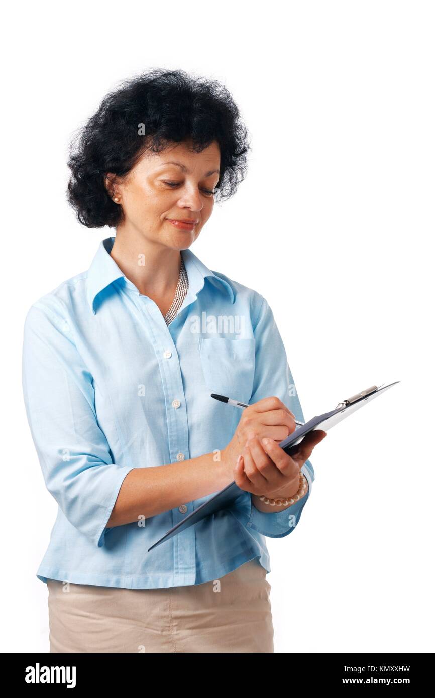 Portrait of a mature woman taking notes over white background Stock ...