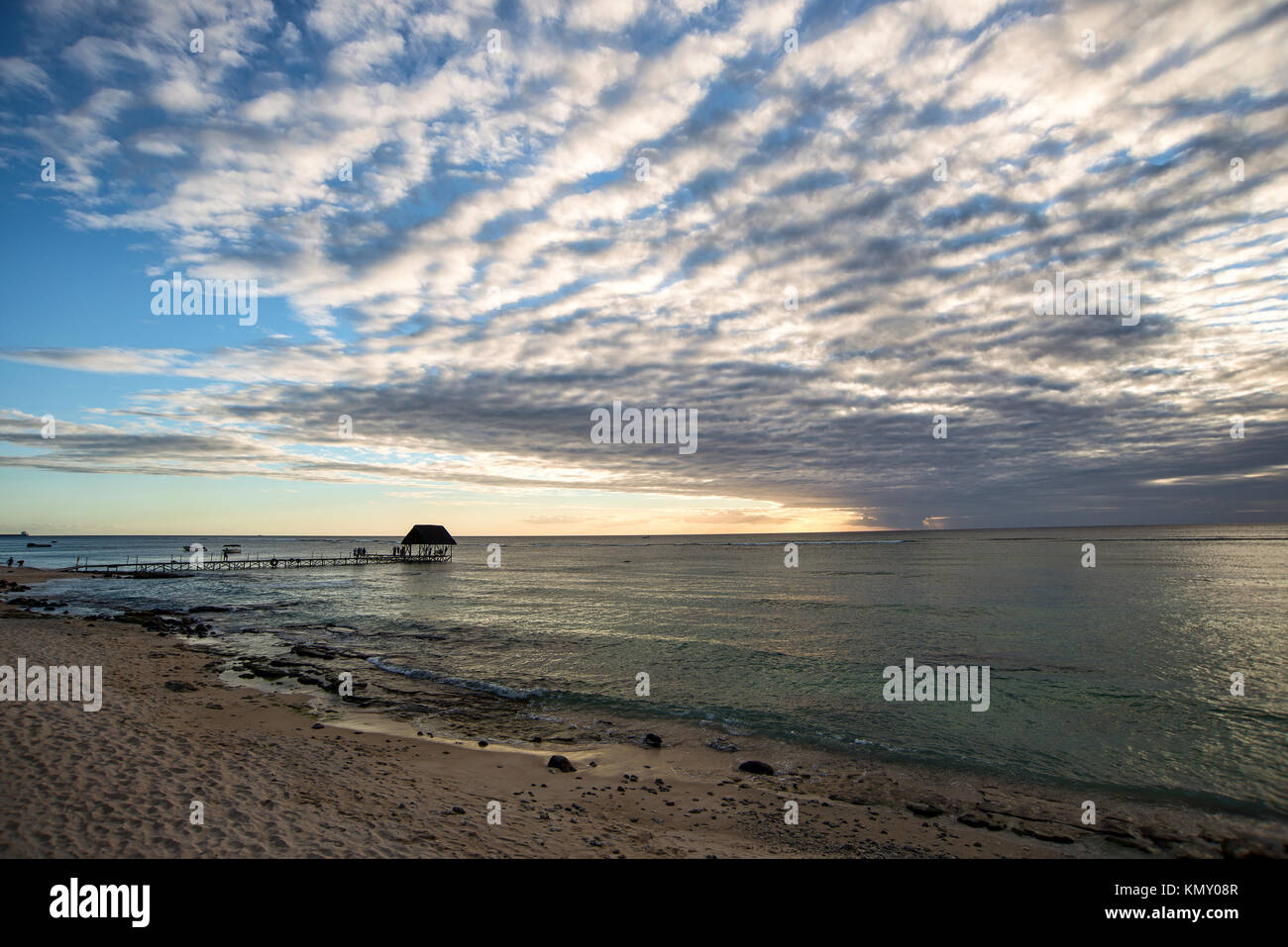 Jetty in Mauritius sea - ocean under patterned cloud cover, dramatic ...
