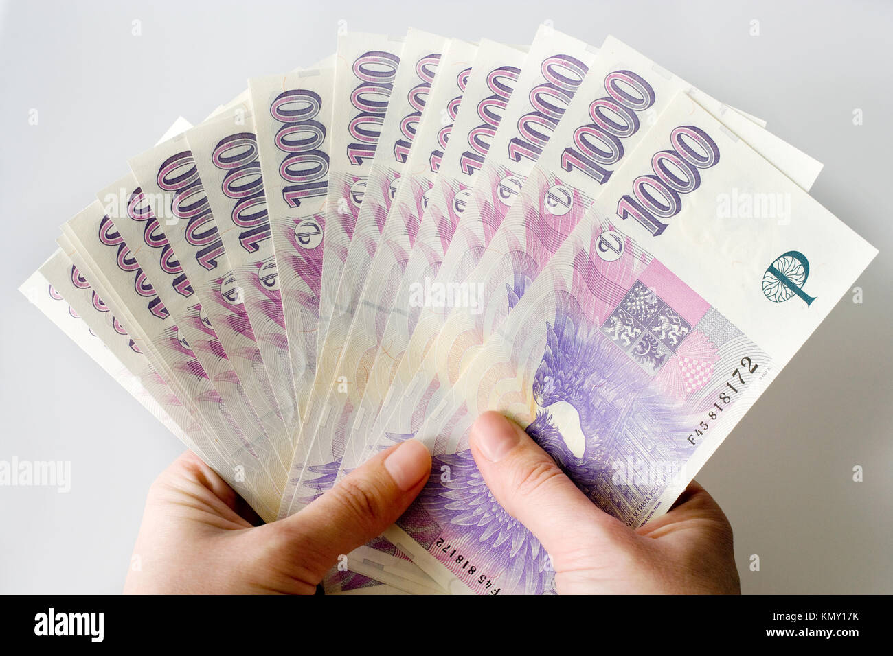 Czech crown CZK currency - banknotes in hand Stock Photo - Alamy