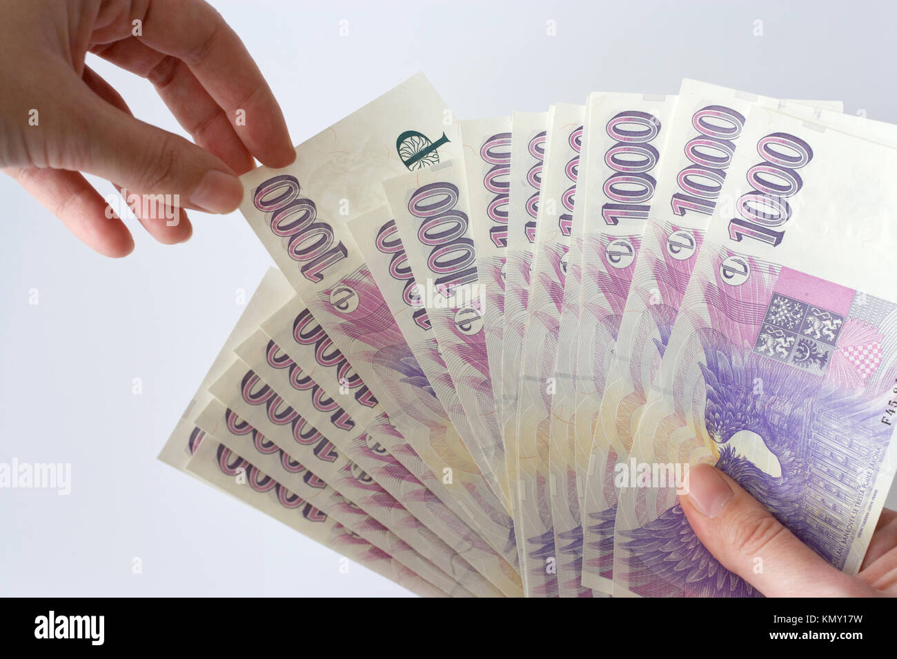 Czech crown CZK currency - banknotes in hand Stock Photo - Alamy