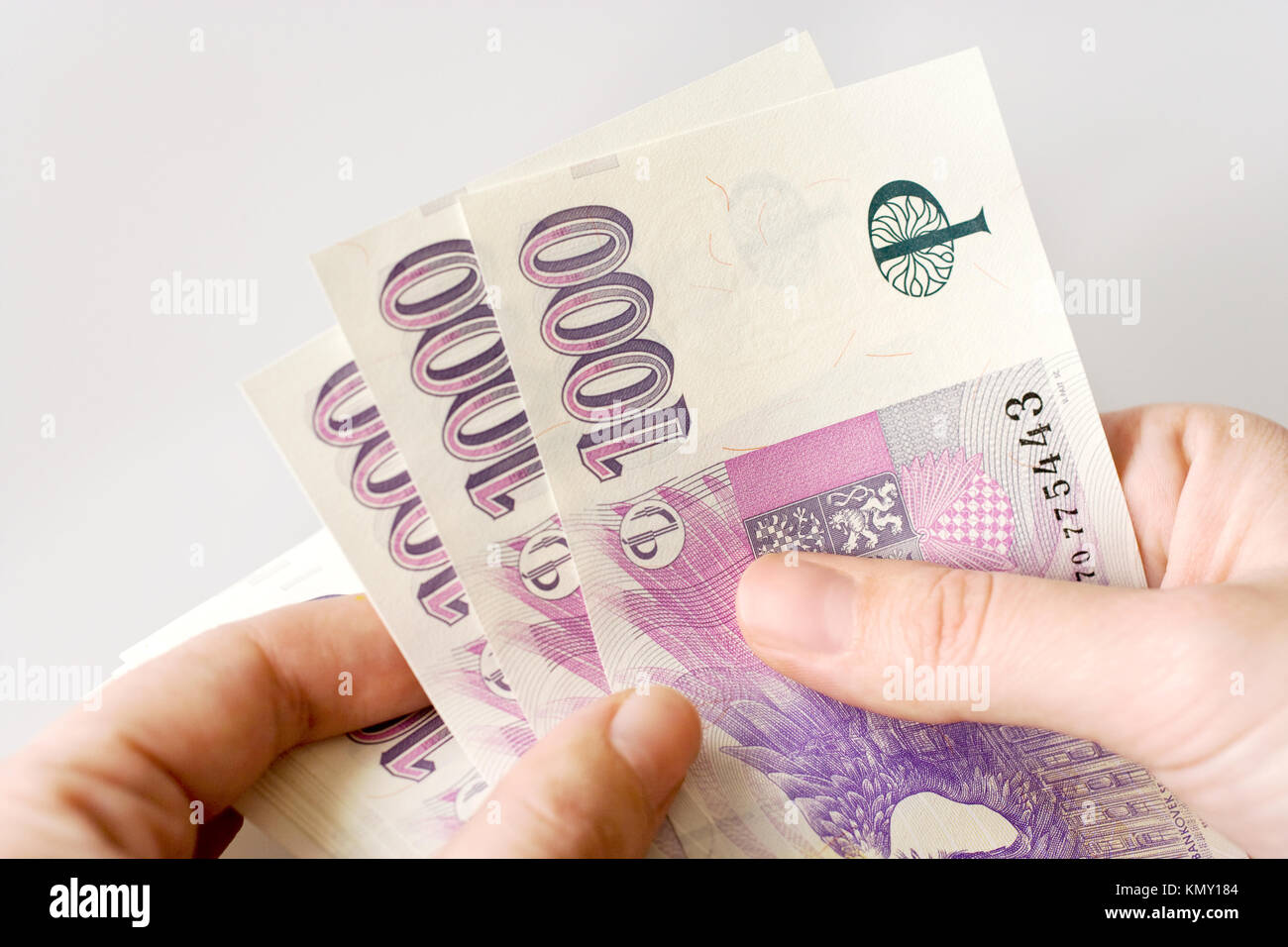 Czech crown CZK currency - banknotes in hand Stock Photo - Alamy