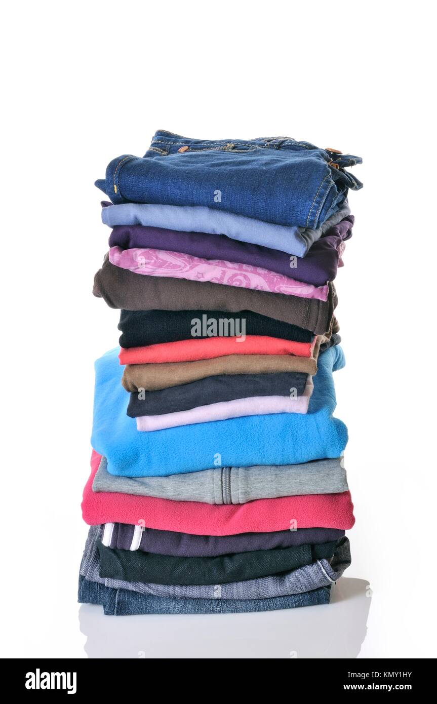 pile of folded clothes on white background Stock Photo - Alamy