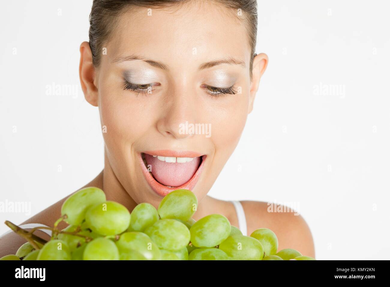 portrait of young woman with grape Stock Photo - Alamy