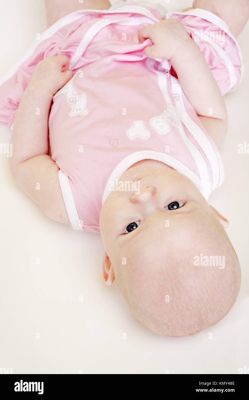 portrait of lying down baby girl Stock Photo - Alamy