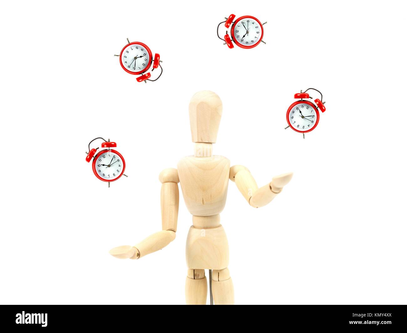 A manikin juggling clocks on a white background Stock Photo - Alamy