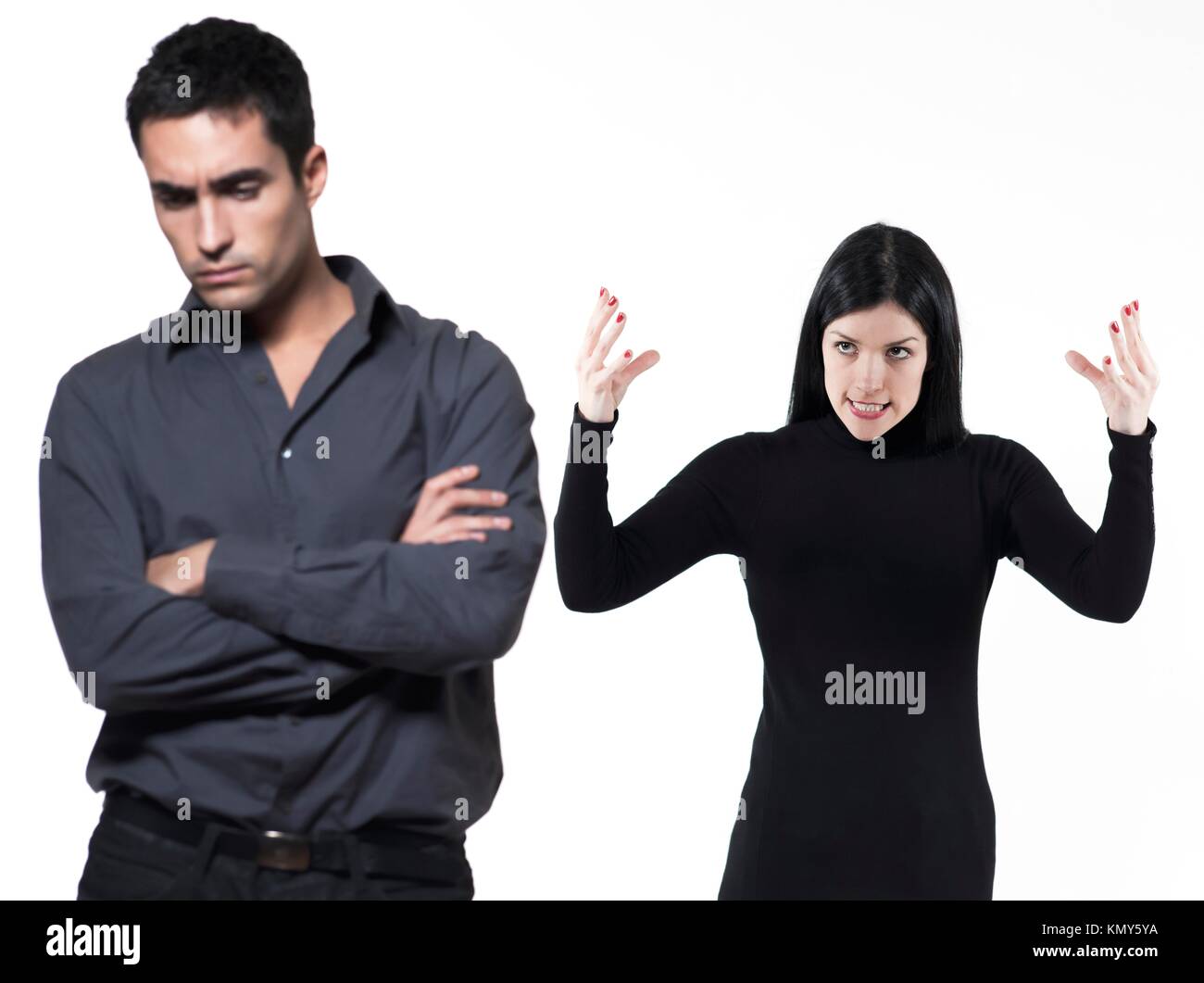 young couple on white background having a dispute Stock Photo - Alamy