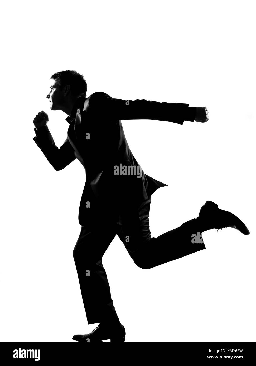 silhouette caucasian business man running profile full length on studio ...