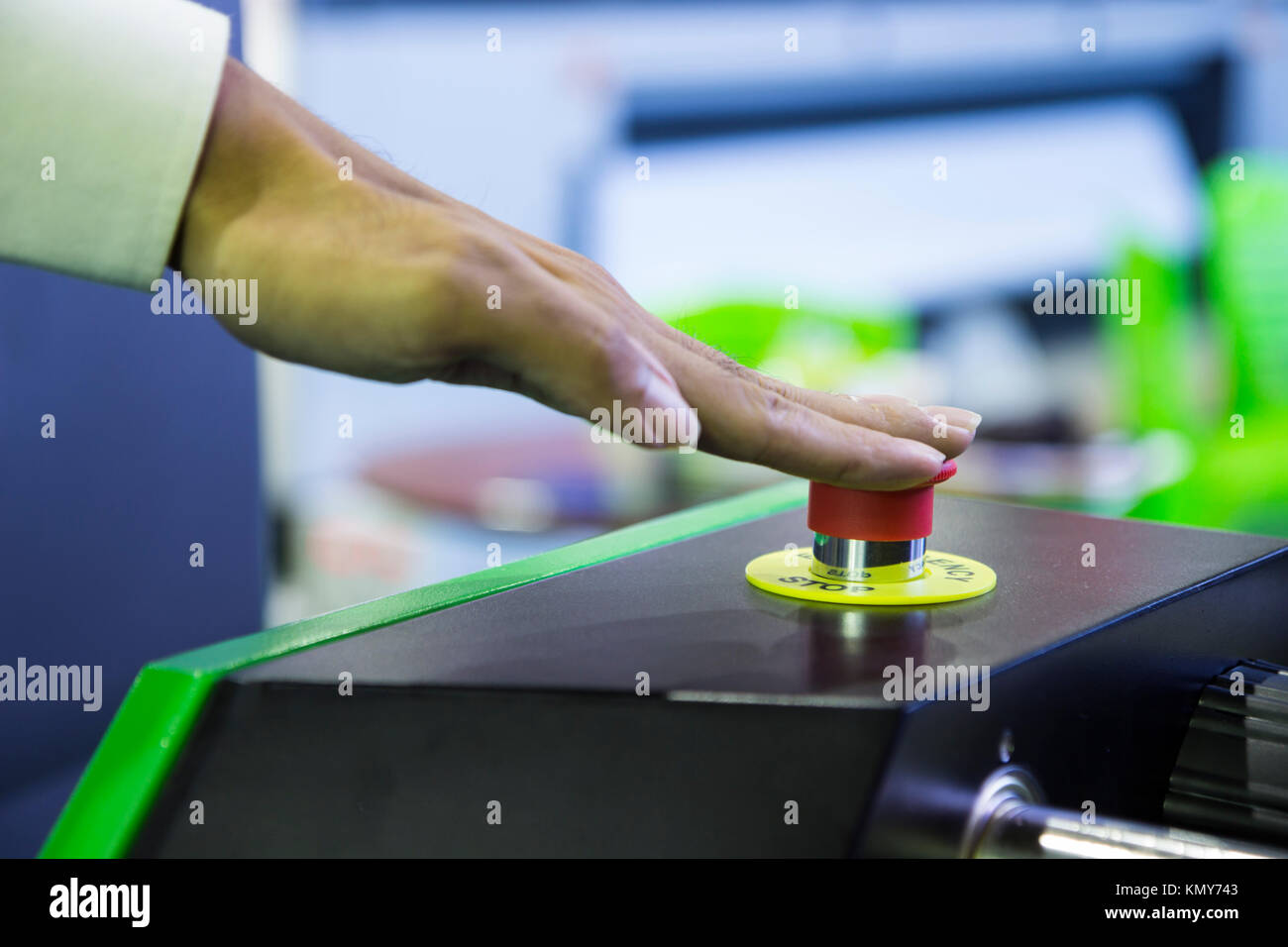 Cluse up emergency stop button push by finger for stopping machine ...