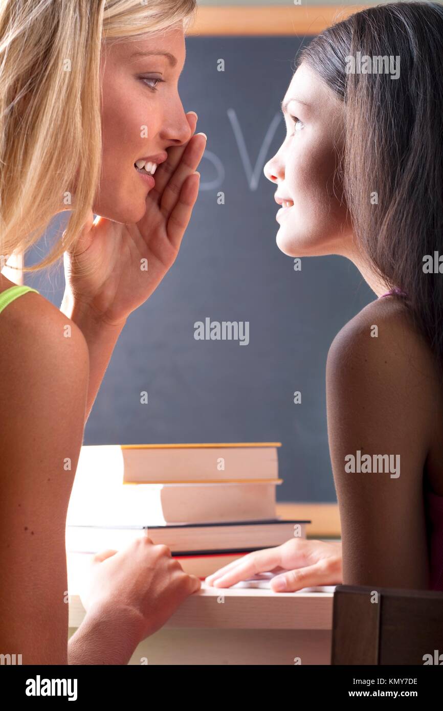 Students chatting white at school Stock Photo - Alamy