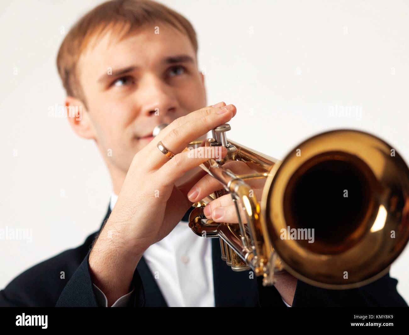 Playing trumpet one hand hi-res stock photography and images - Alamy