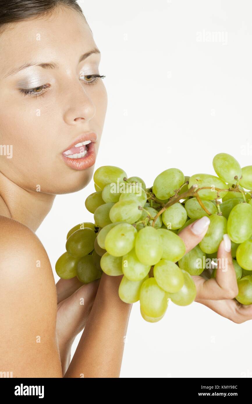 portrait of young woman with grape Stock Photo - Alamy