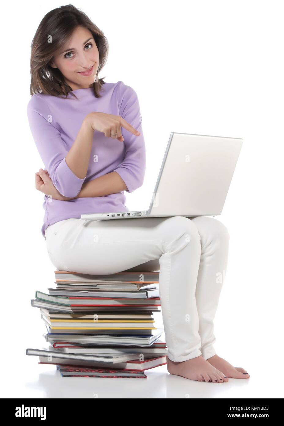 Woman sitting on stack books hi-res stock photography and images - Alamy