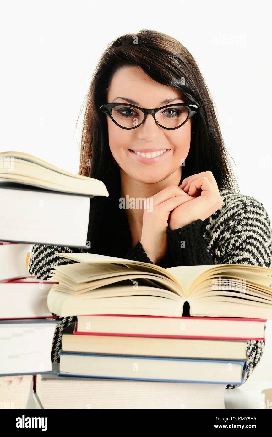 Young woman with books isolated on white Female student learning Stock ...