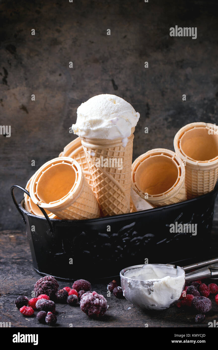 Homemade vanilla ice cream in wafer cones empty cones hi-res stock ...