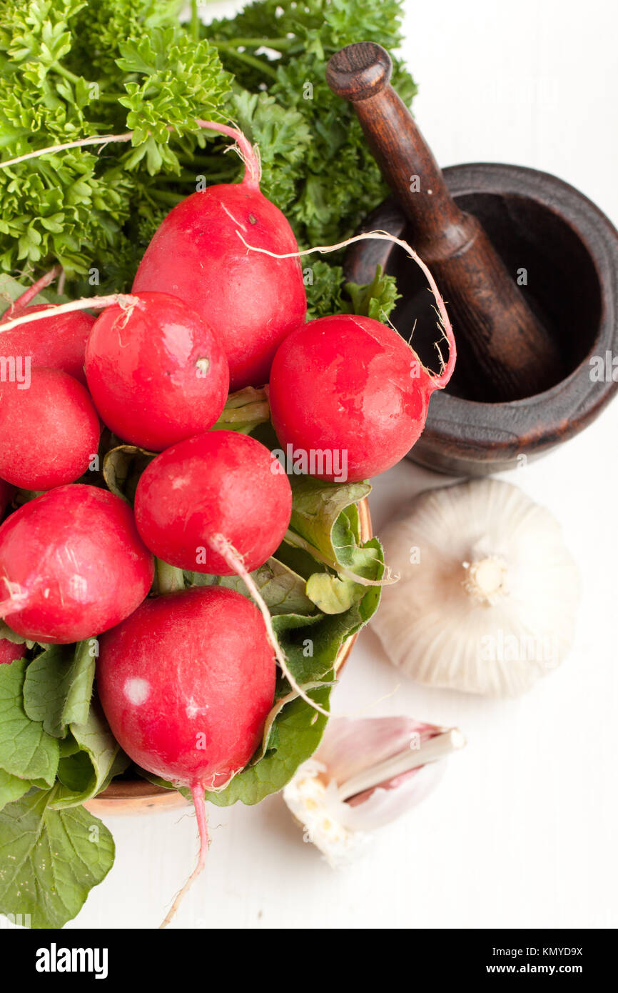 Top view on bunch of fresh radishes with garlic, parsley and vintage ...
