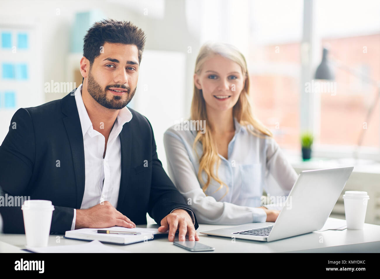 Colleagues in office Stock Photo - Alamy