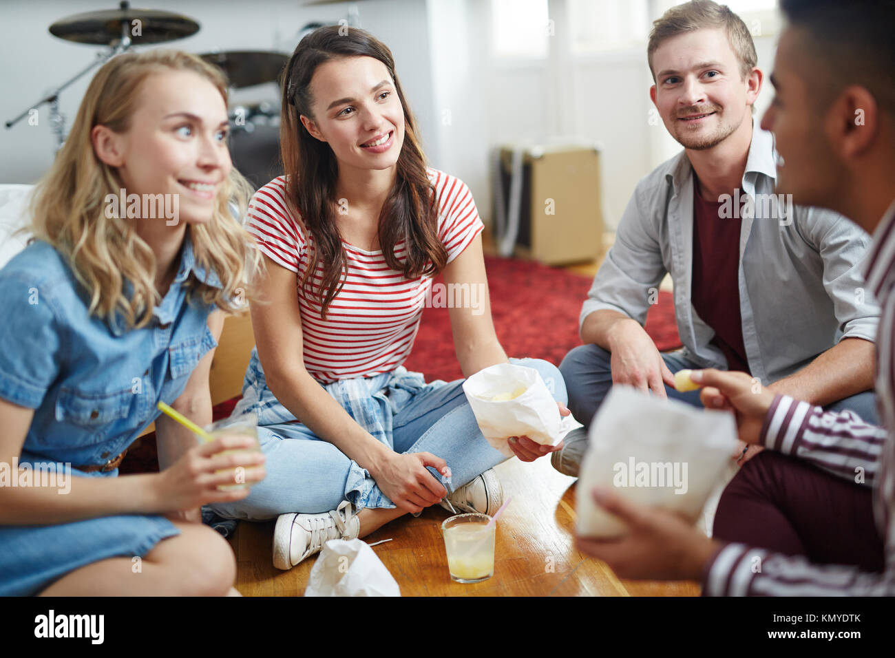 Friends having snack Stock Photo - Alamy