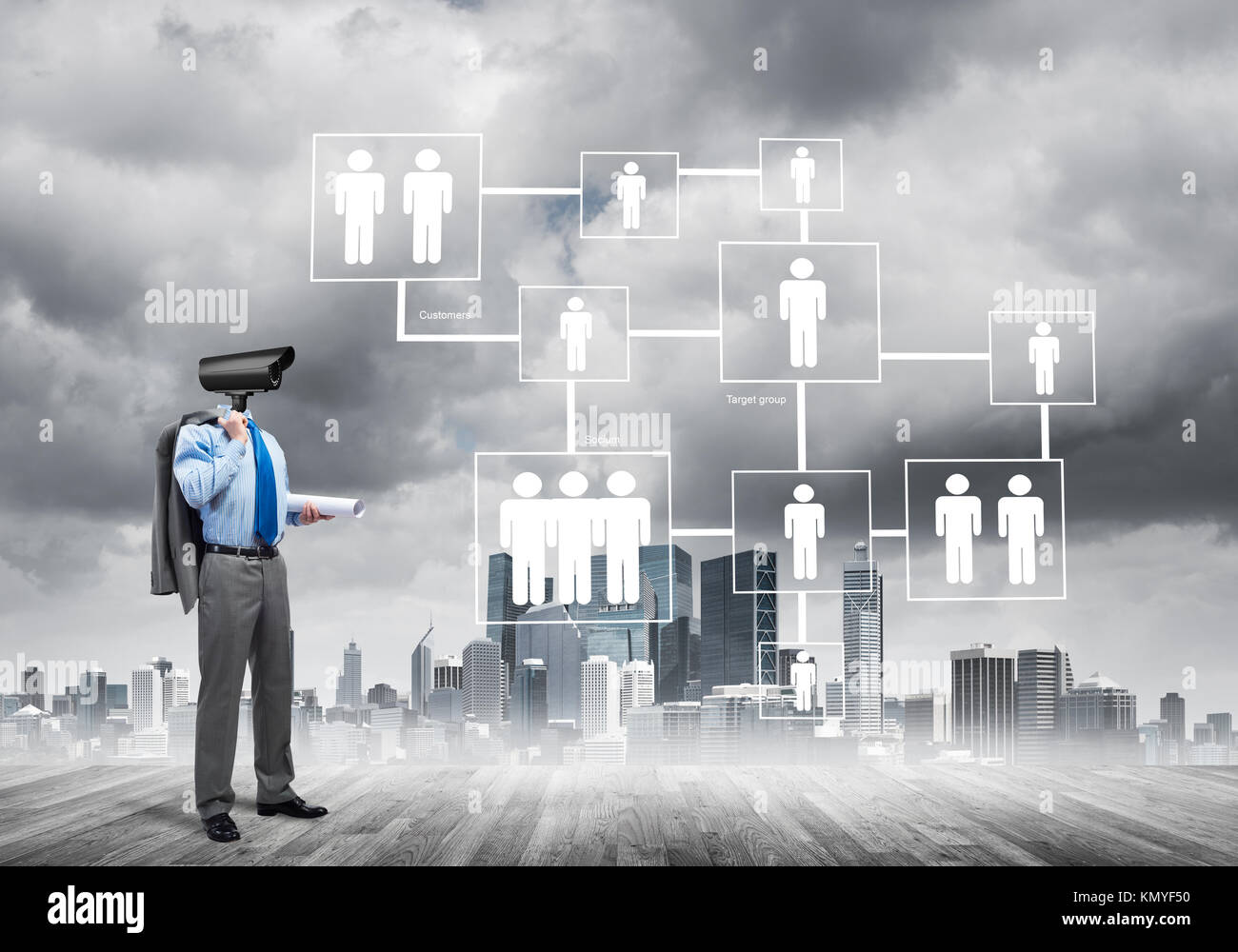 Camera headed man standing on wooden floor against modern cityscape ...