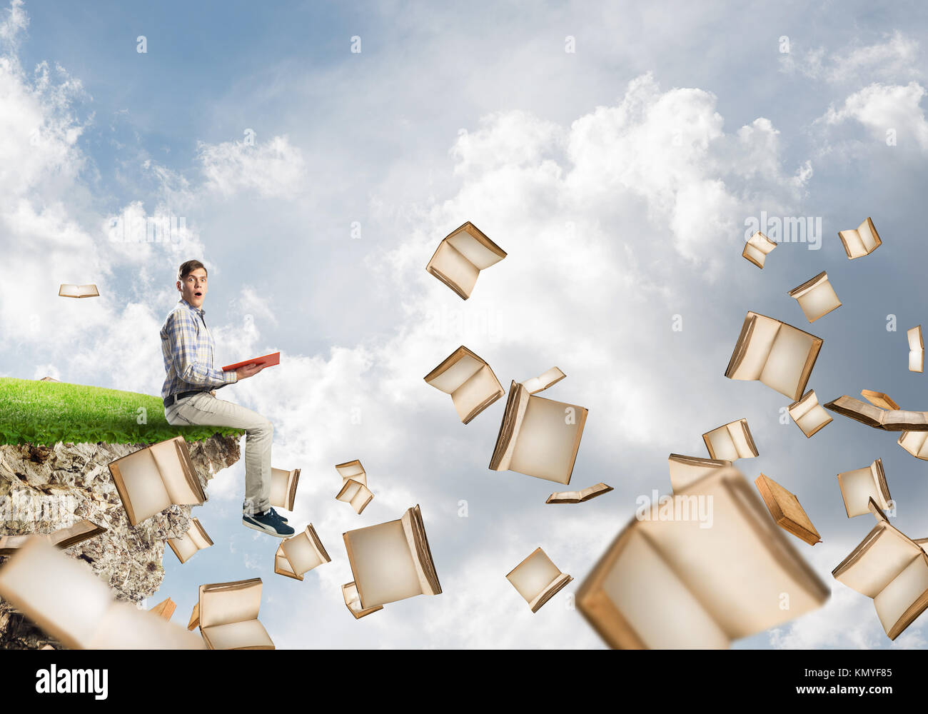 Man reading book and many of them flying in air Stock Photo - Alamy