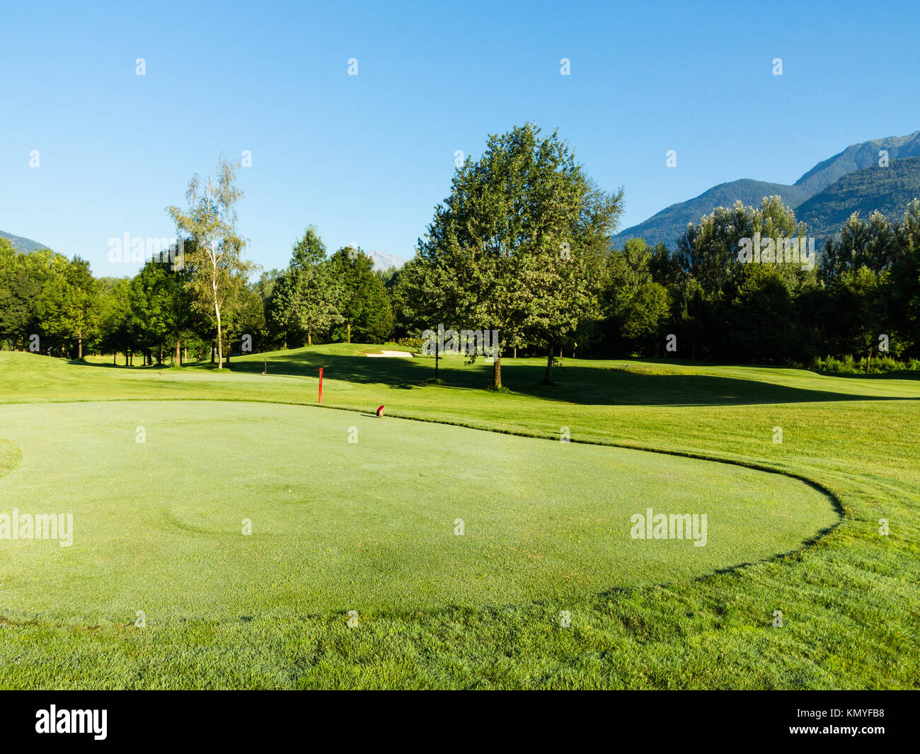 Golf course, holes and green Stock Photo - Alamy